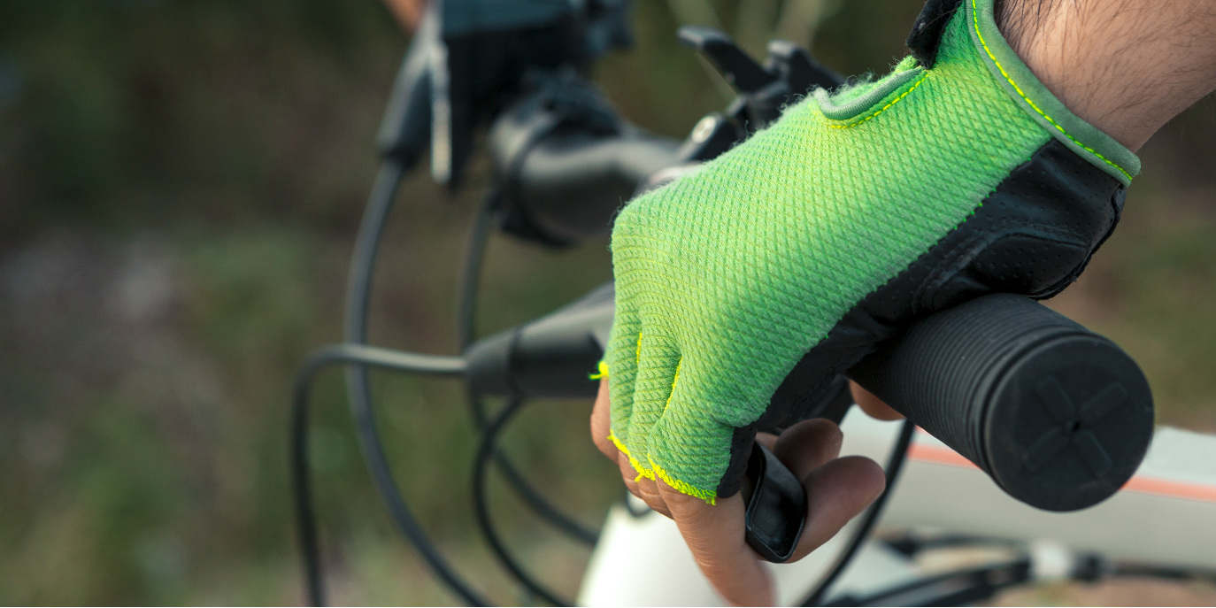 worn-green-cycling-gloves-on-handlebar.jpg